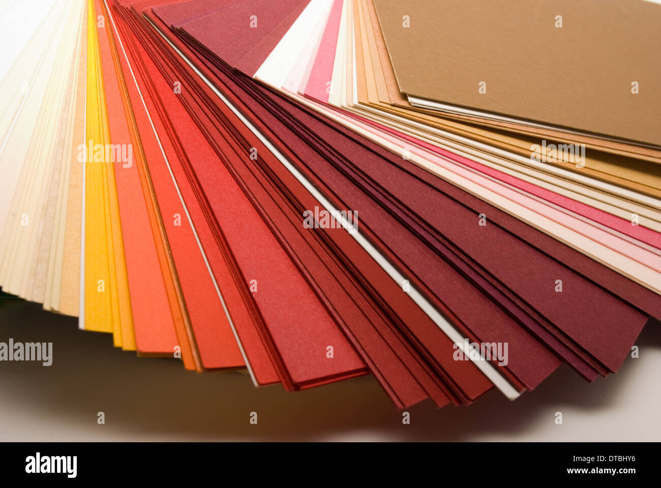 Colored paper stock stand on white background Stock Photo - Alamy