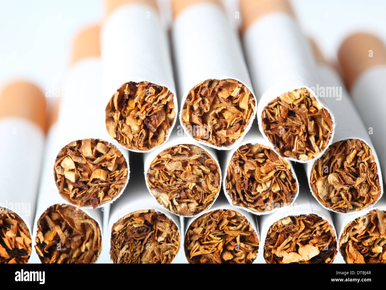 Closeup view of a pile of cigarettes Stock Photo - Alamy