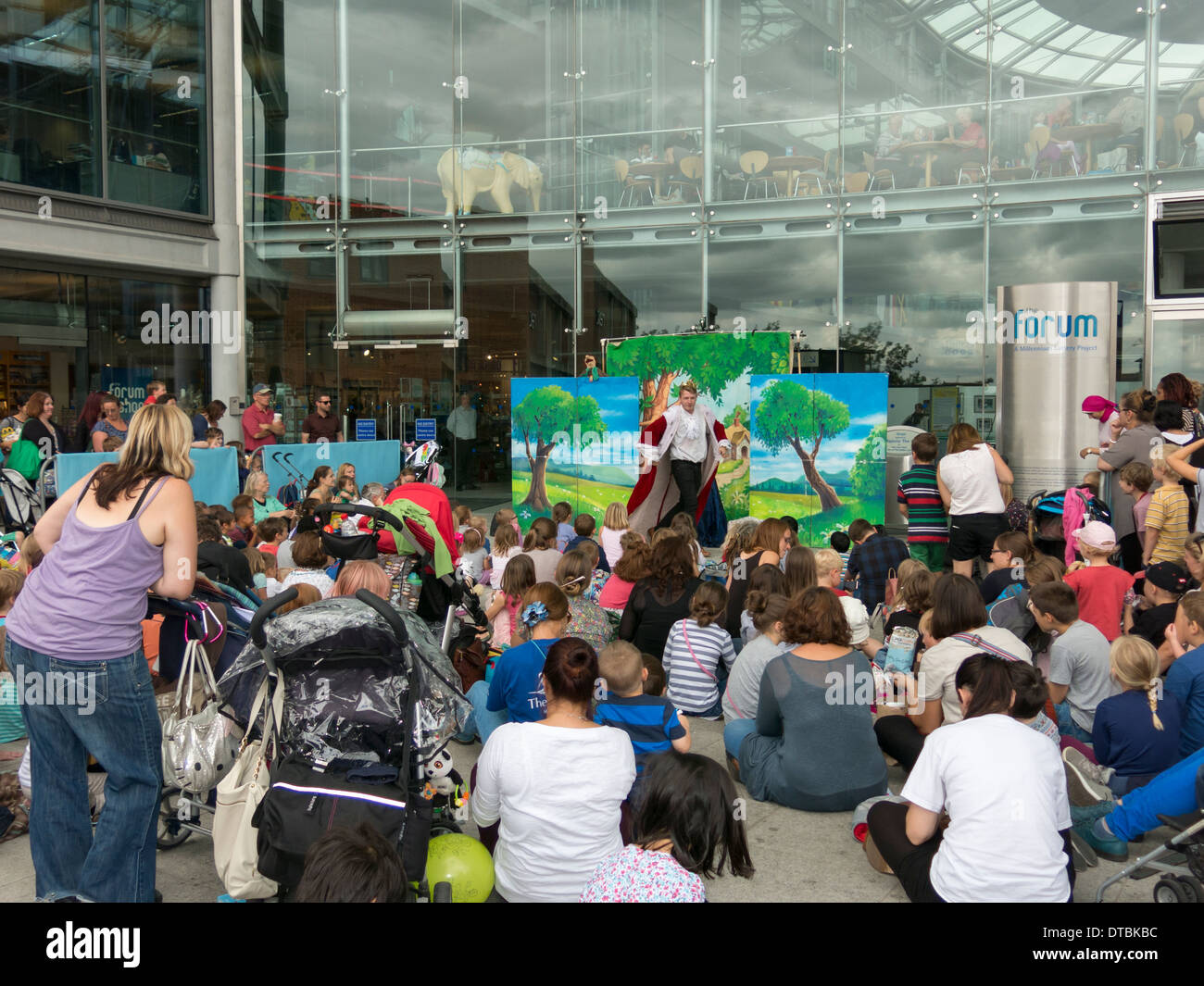 Crowd children adults watching story play hi-res stock photography and ...