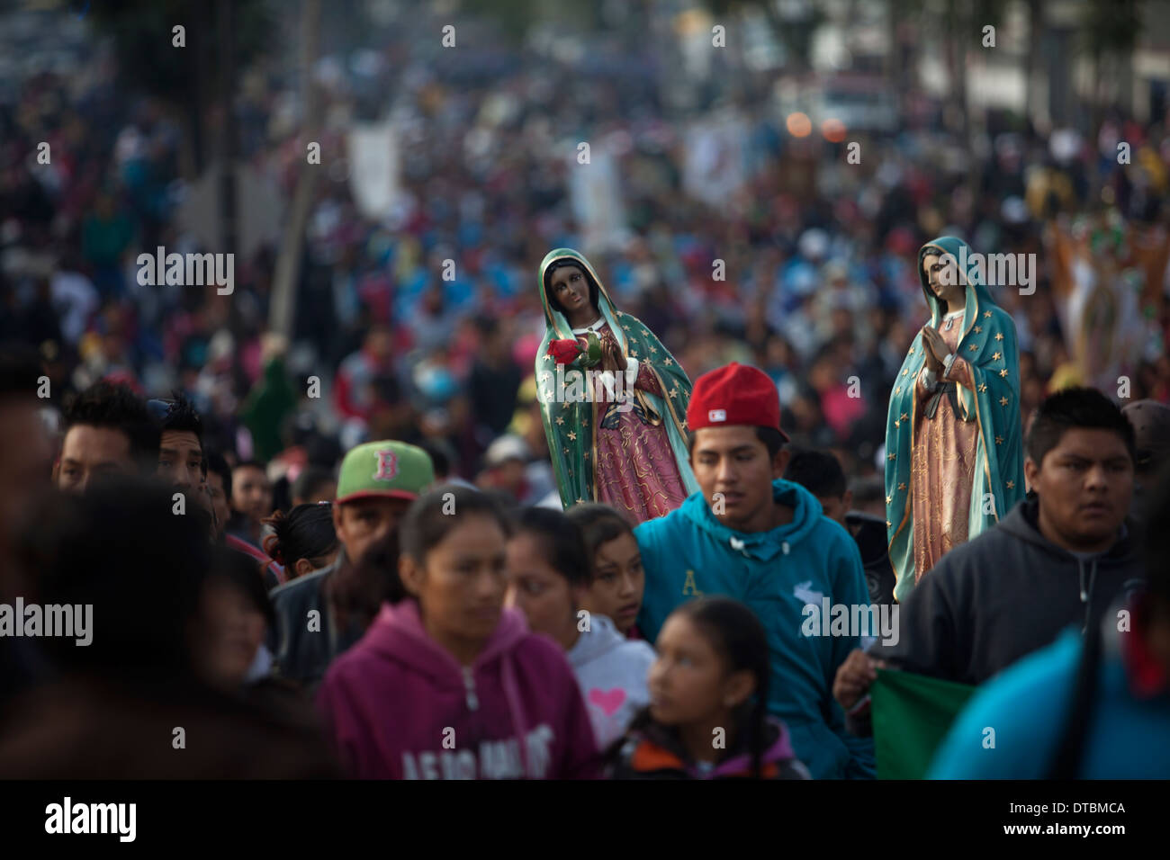 Pilgrims hold an image of the Virgin of Guadalupe at the pilgrimage to ...