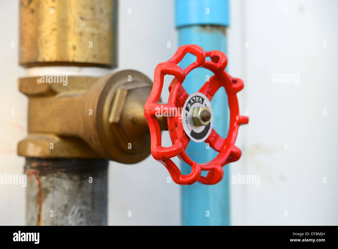 red valves with brass pipes Stock Photo - Alamy