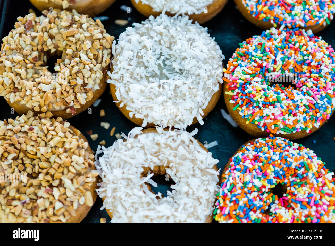 Fresh donuts with different toppings from the local bakery shop Stock ...