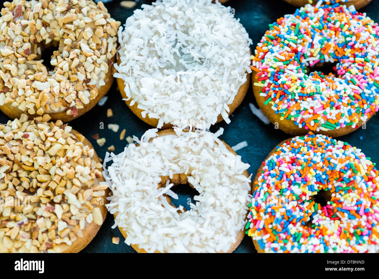 Fresh donuts with different toppings from the local bakery shop Stock ...