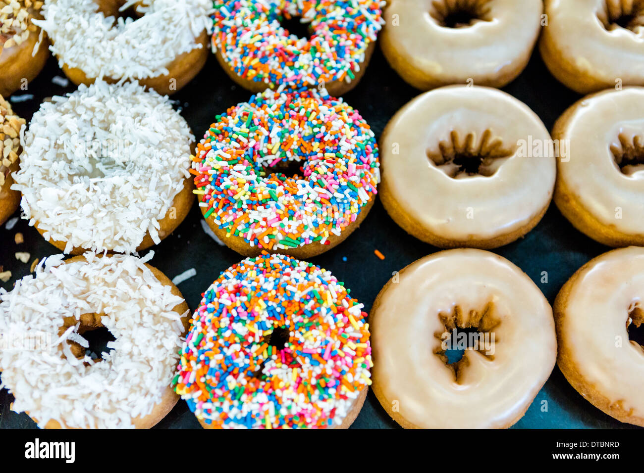 Fresh donuts with different toppings from the local bakery shop Stock ...