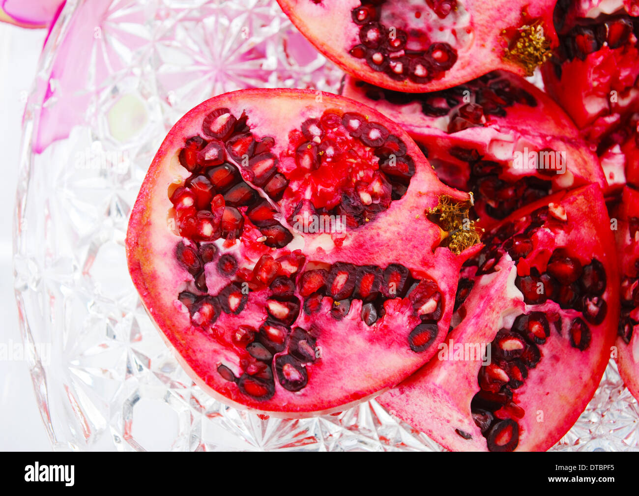 Ripe ruby red pomegranate fruit cut in columns showing rich deep red ...