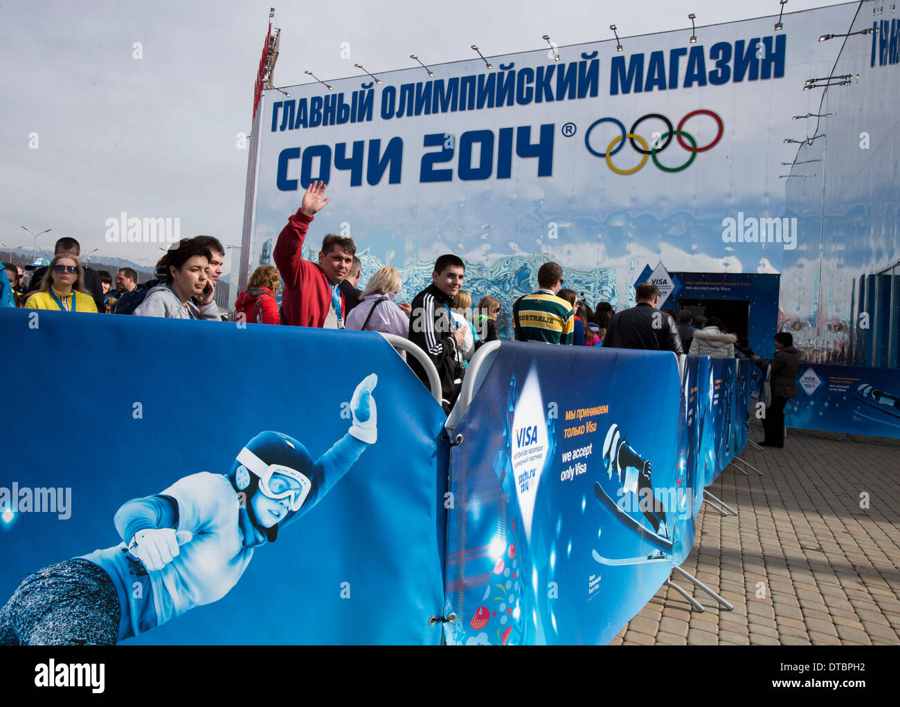Sochi, Russia. 14th Feb, 2014. The Olympic fans wait in line at the ...
