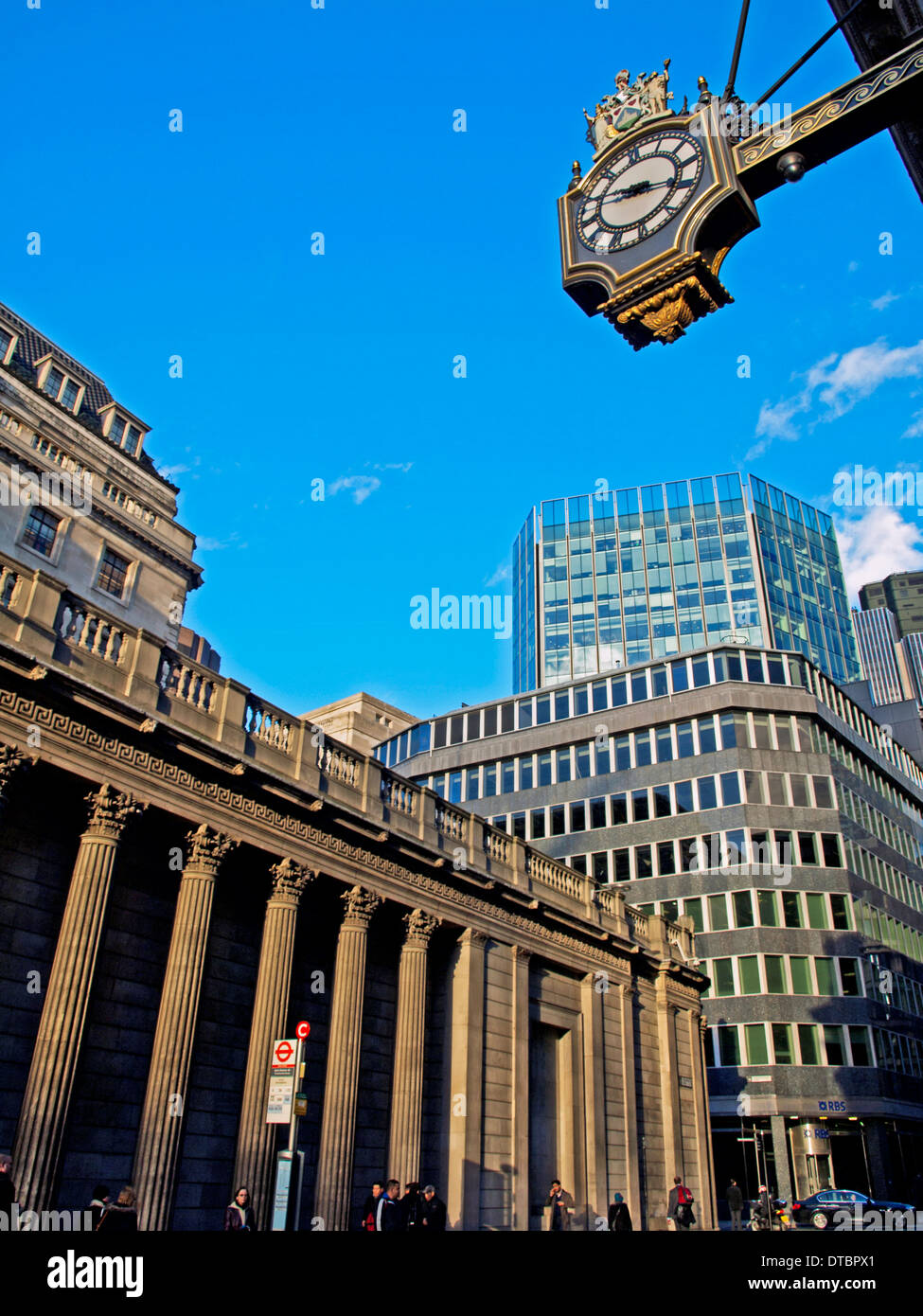Clock in the City of London showing the Stock Exchange Tower, London ...