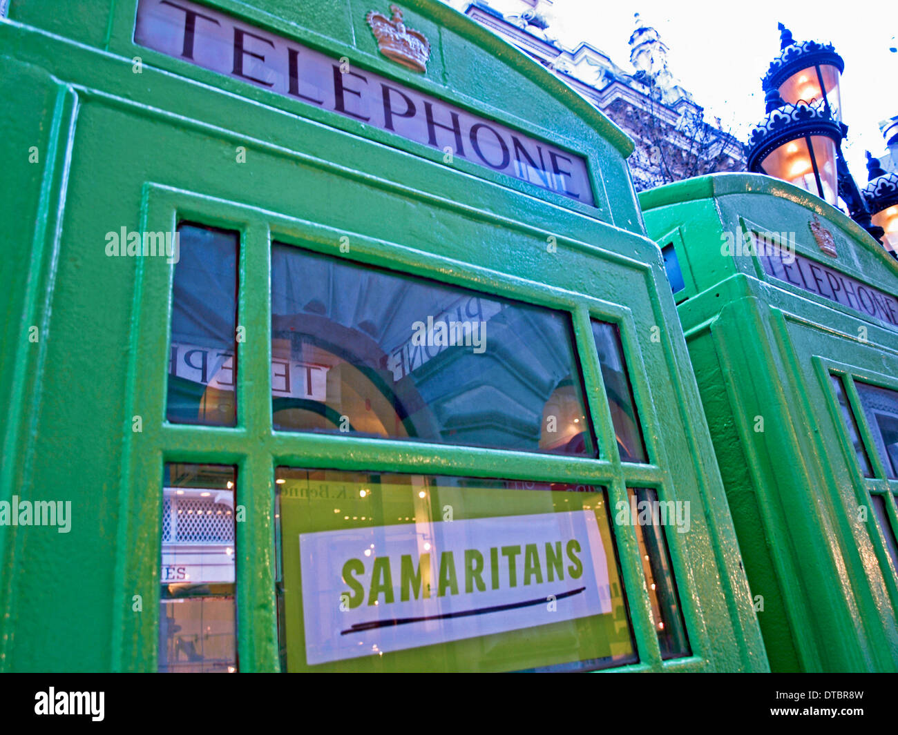 Traditional red telephone boxes painted green to celebrate Samaritans ...