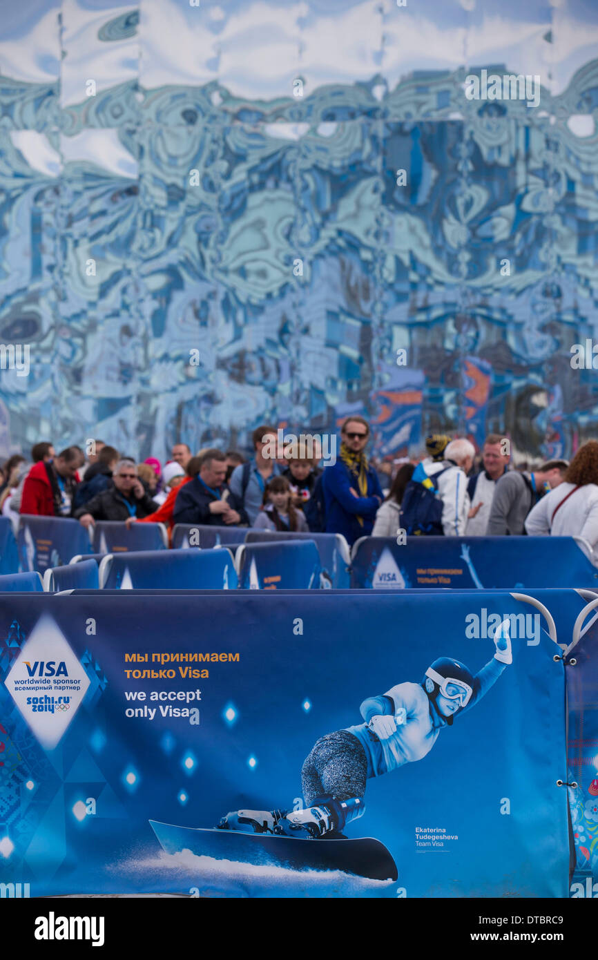 Sochi, Russia. 14th Feb, 2014. The Olympic fans wait in line at the ...