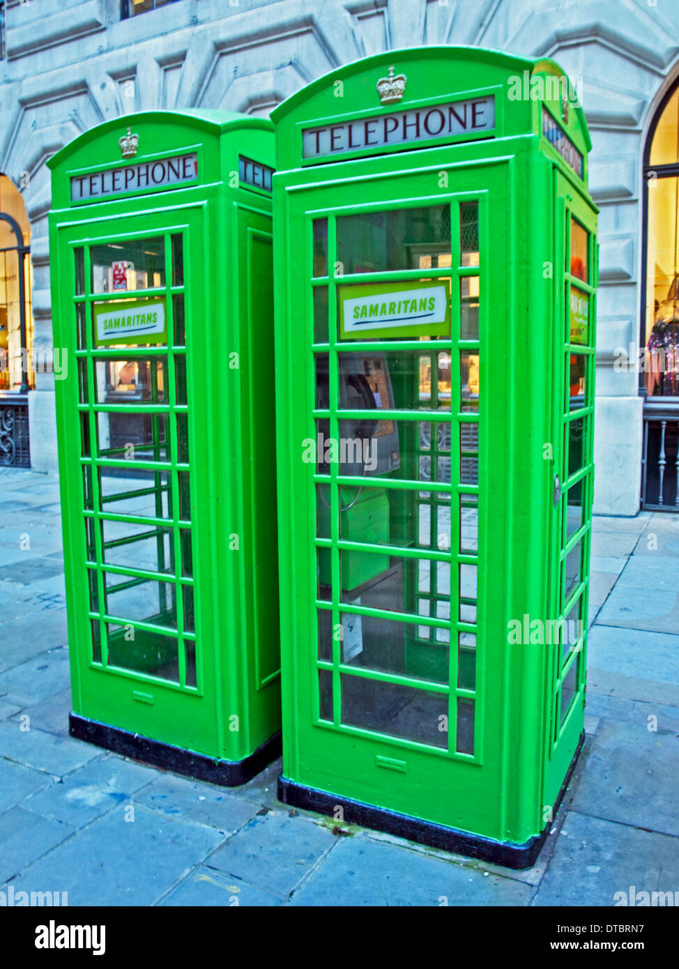 Traditional red telephone boxes painted green to celebrate Samaritans ...