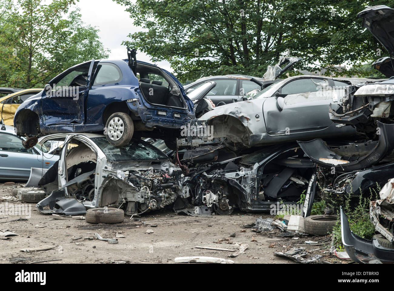 Crushed cars in scrap yard UK Stock Photo - Alamy