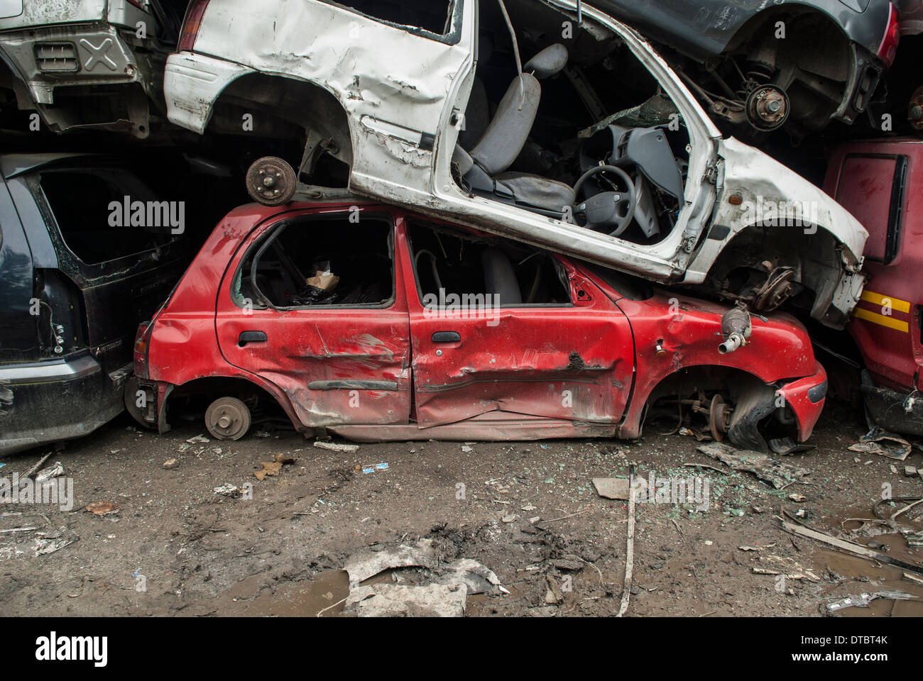 Crushed cars in scrap yard UK Stock Photo - Alamy