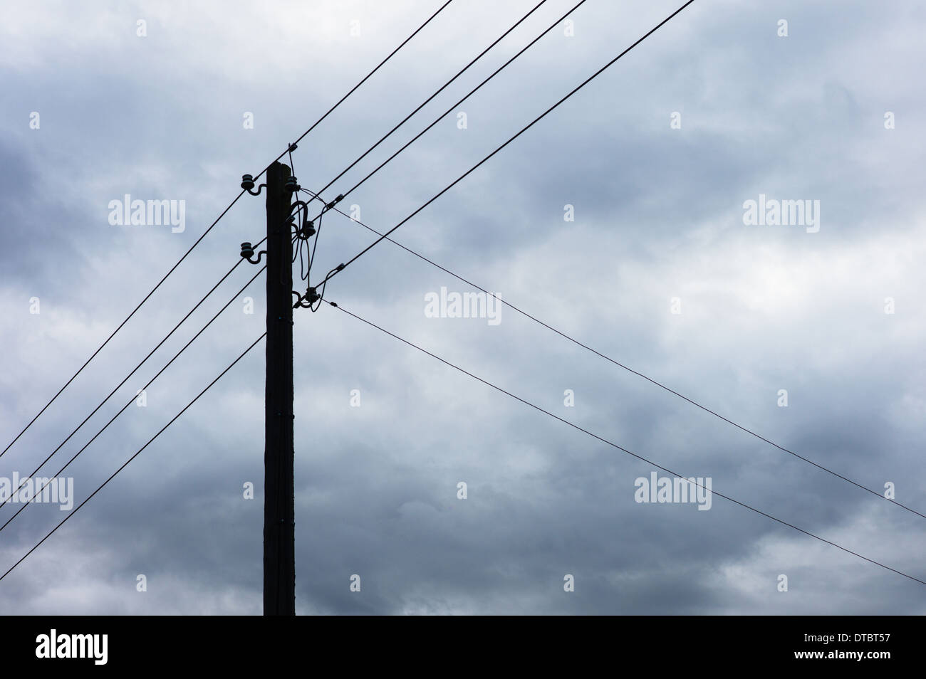 Electricity pylon with dark clouds hi-res stock photography and images ...