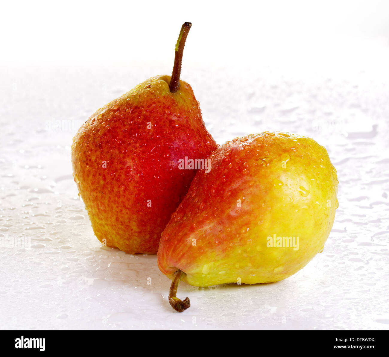 Two yellow-red pears on a white background Stock Photo - Alamy