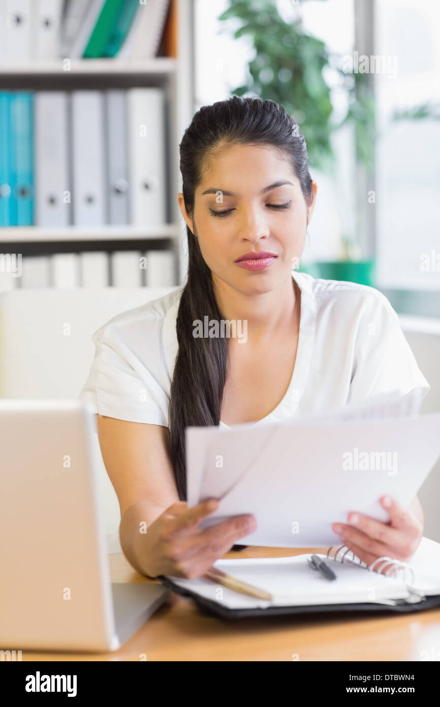 Beautiful businesswoman reading documents hi-res stock photography and images - Alamy