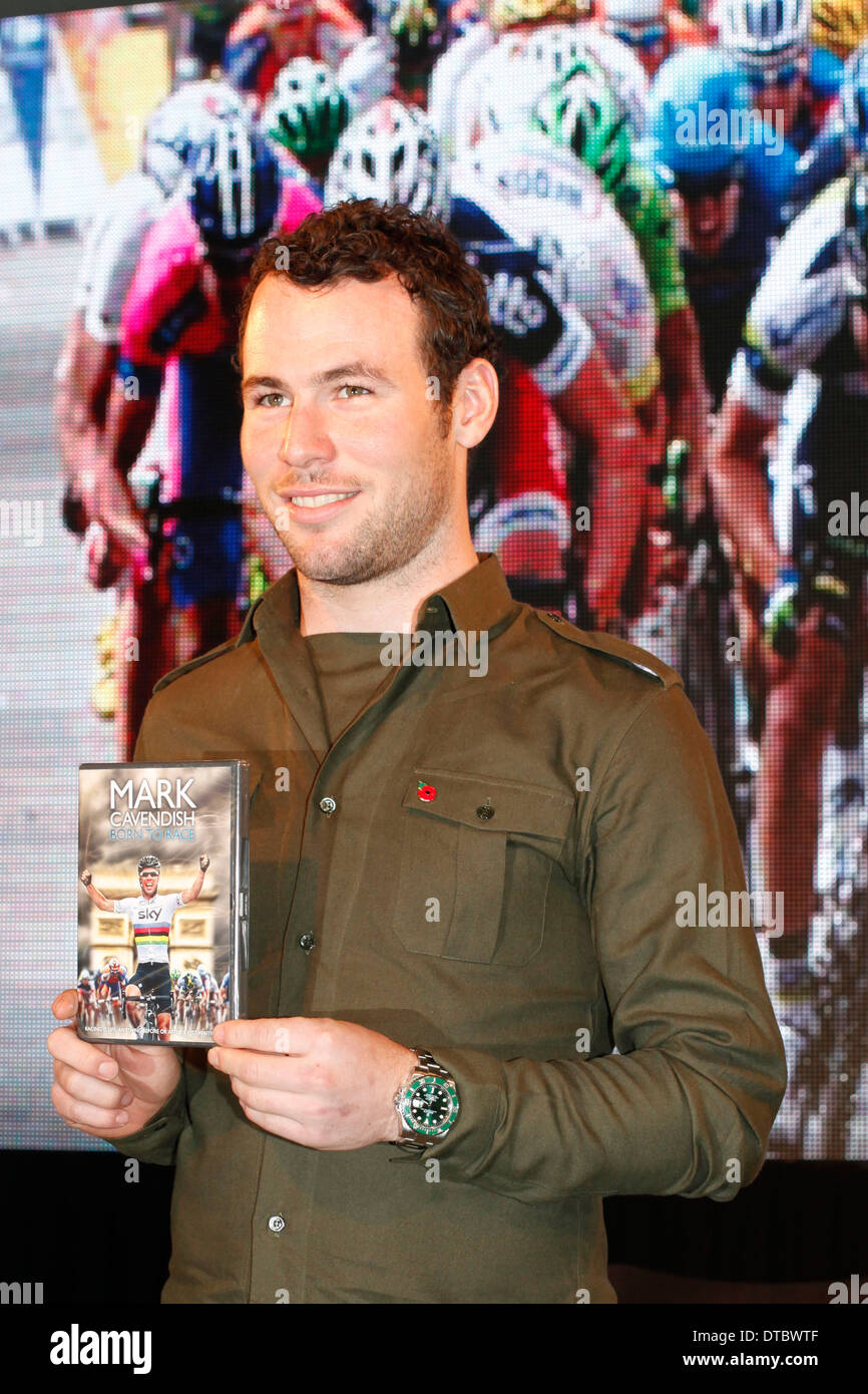 Mark Cavendish poses for a photograph during a signing event to his new ...