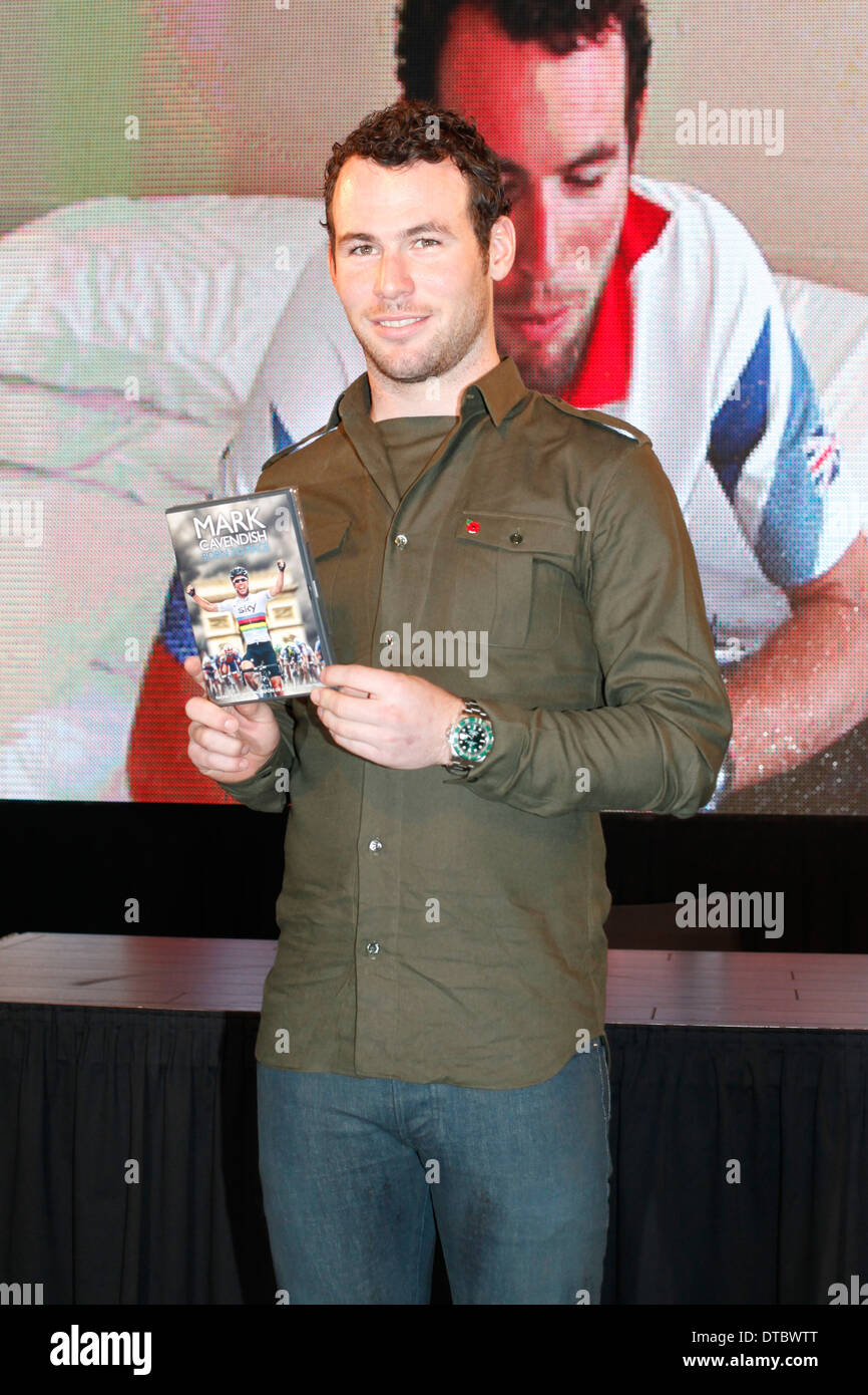 Mark Cavendish poses for a photograph during a signing event to his new ...