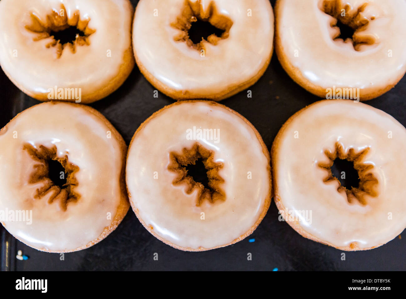 Row of fresh donuts from the local bakery shop Stock Photo - Alamy
