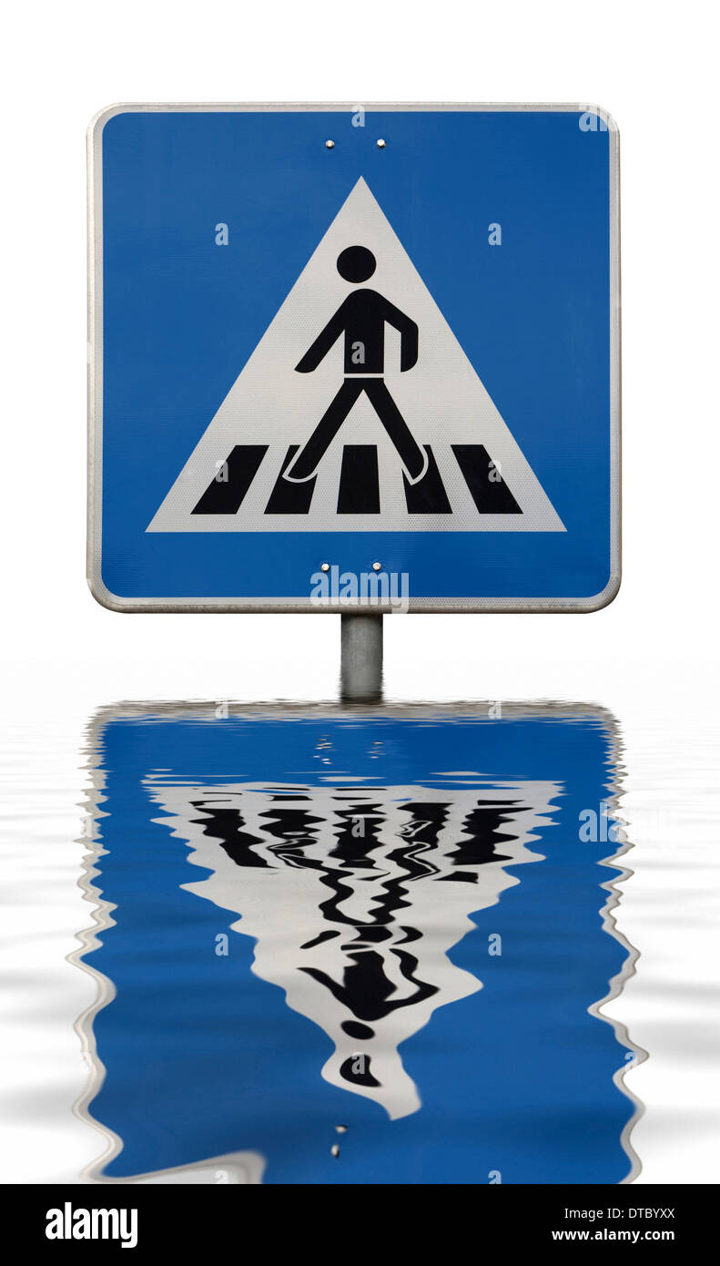sunken blue crosswalk sign on reflective water surface in white back ...
