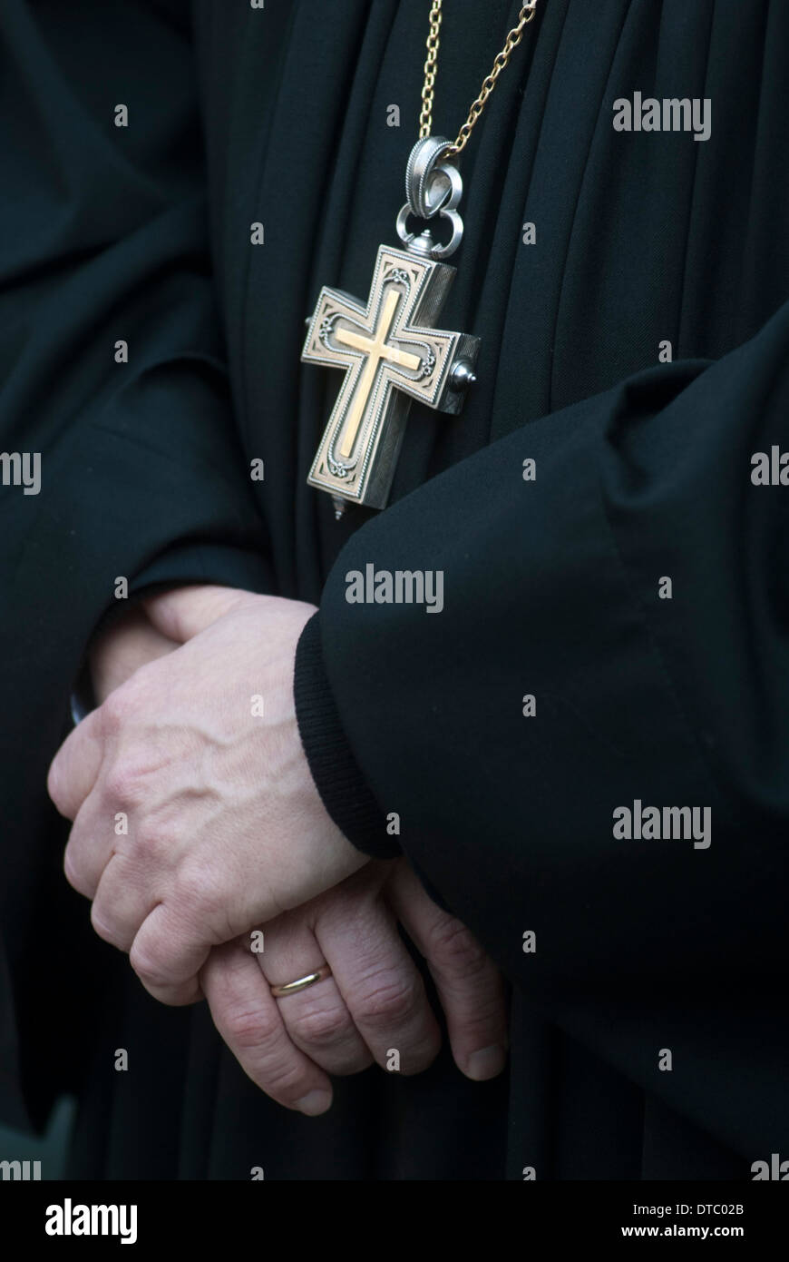 Priest with cross Stock Photo - Alamy