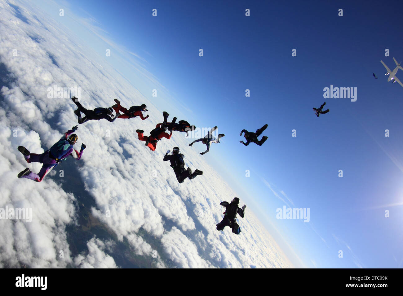 Large formation skydiving exit Stock Photo - Alamy