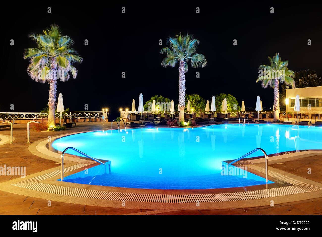 Swimming pool in night illumination Stock Photo - Alamy