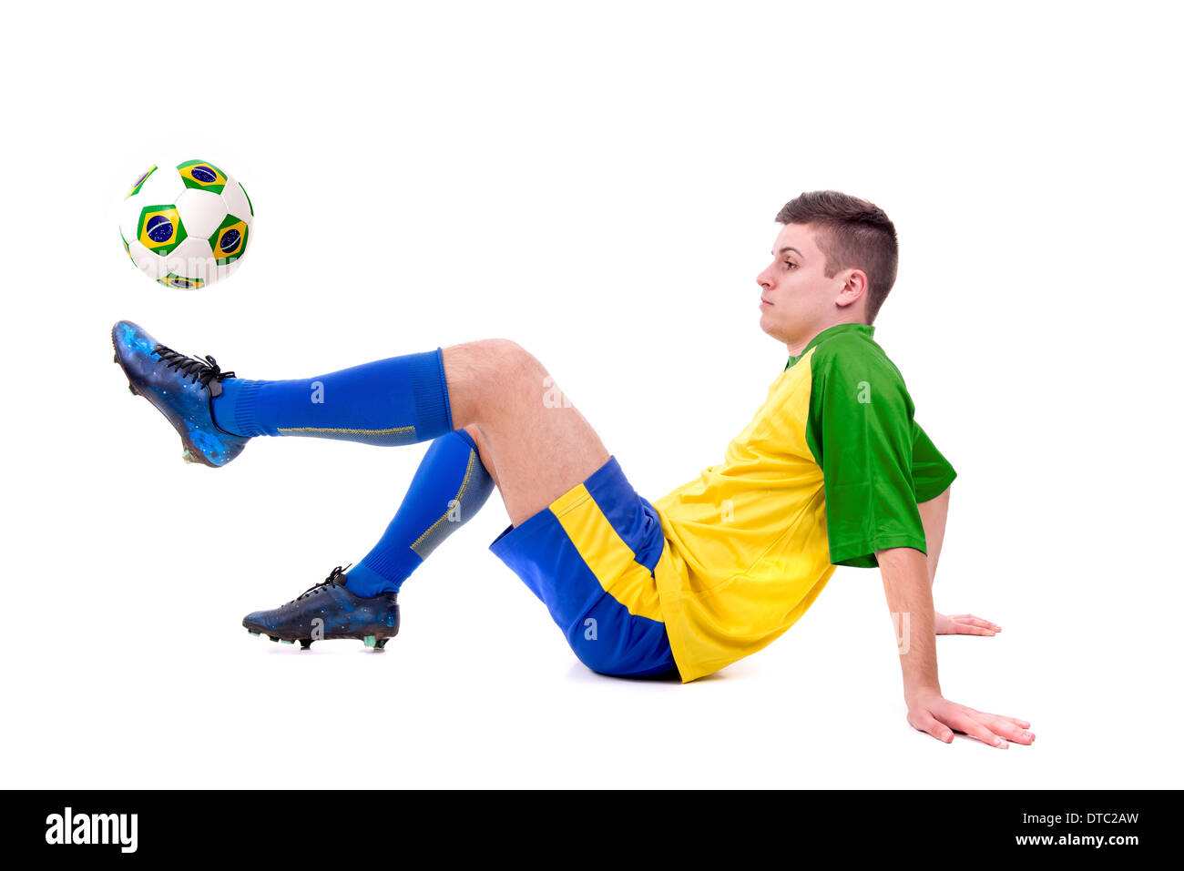Football player with ball isolated in white Stock Photo - Alamy