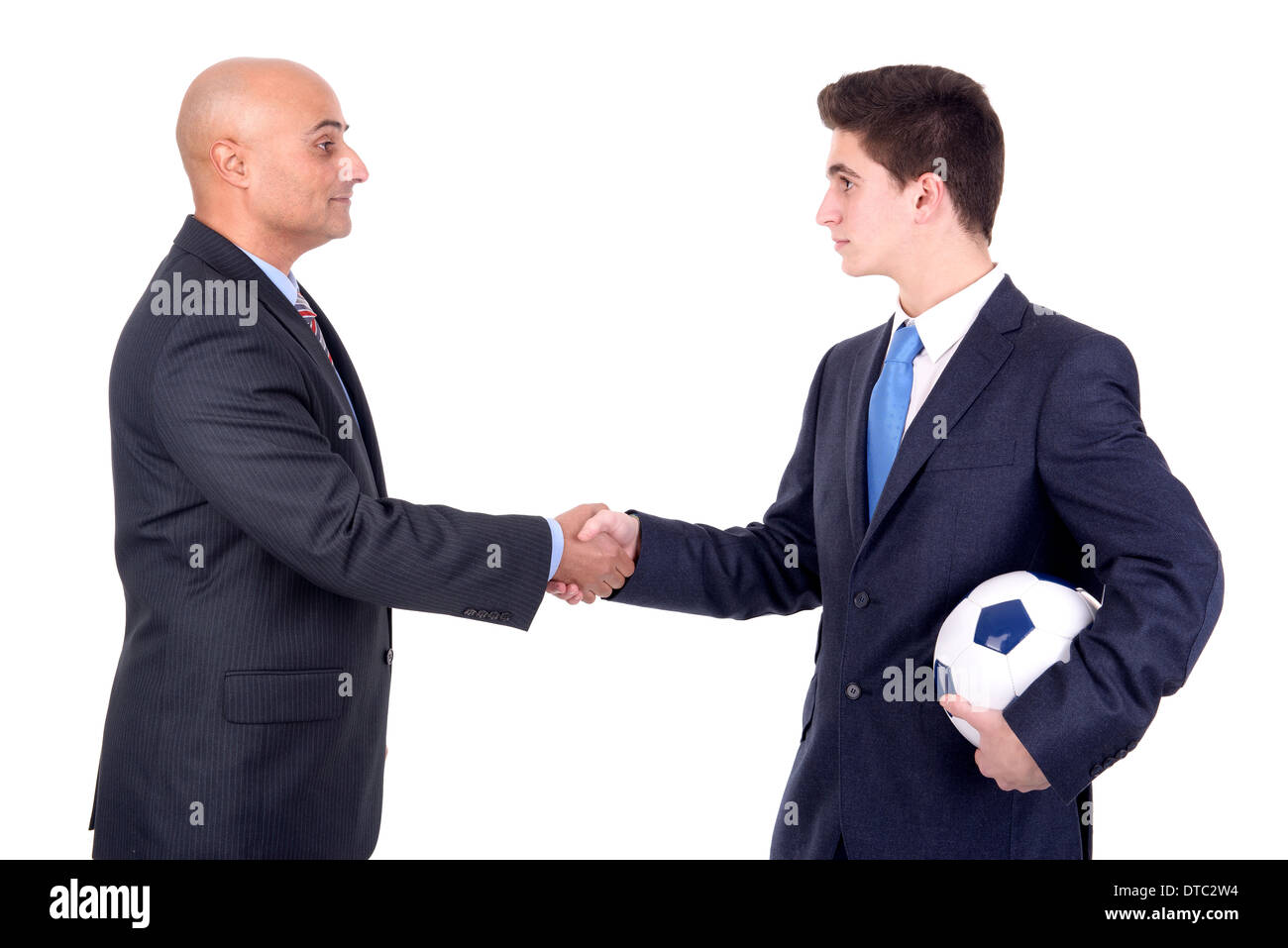 Businessmen shaking hands over a football match isolated in white Stock ...