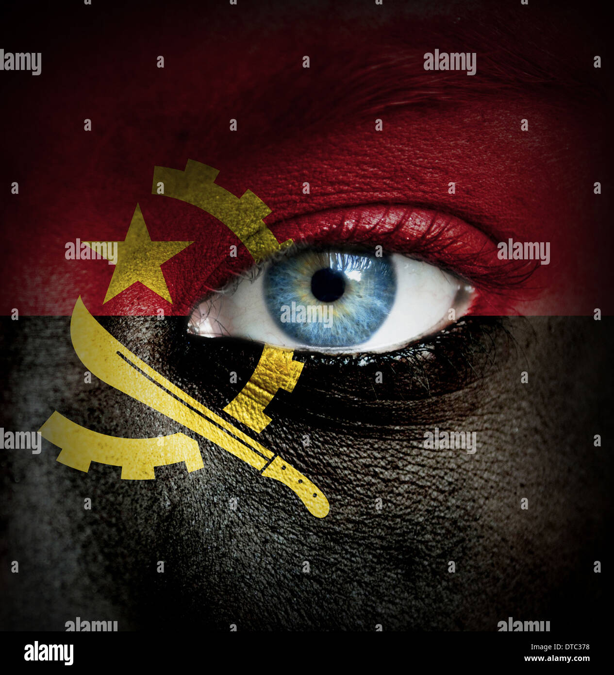Human face painted with flag of Angola Stock Photo - Alamy