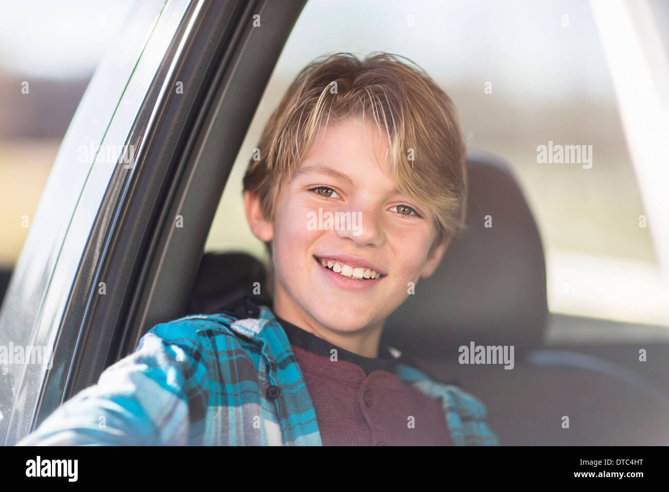 Boy smiling in car Stock Photo - Alamy