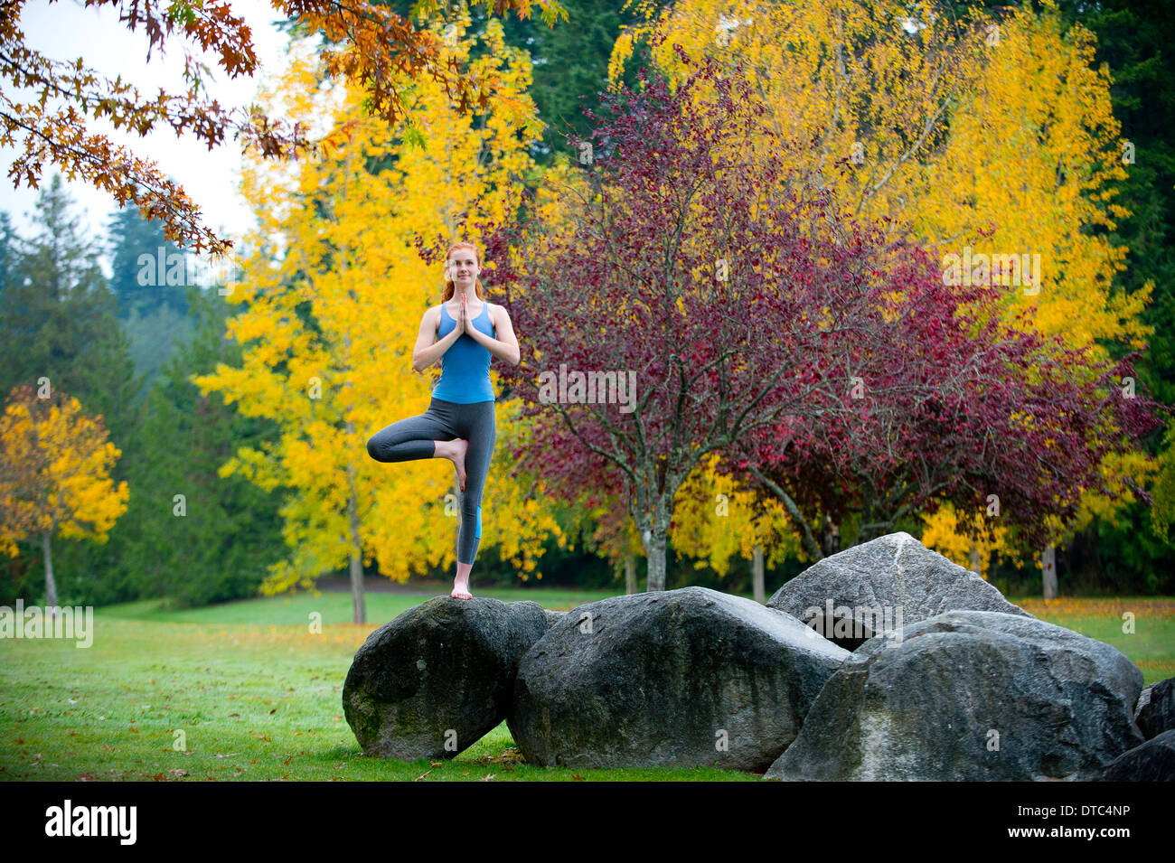 Woman stands on yoga hi-res stock photography and images - Alamy