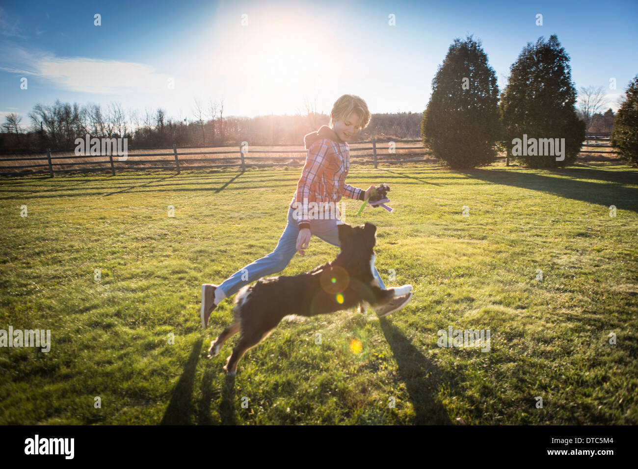 Boy running with dog hi-res stock photography and images - Alamy