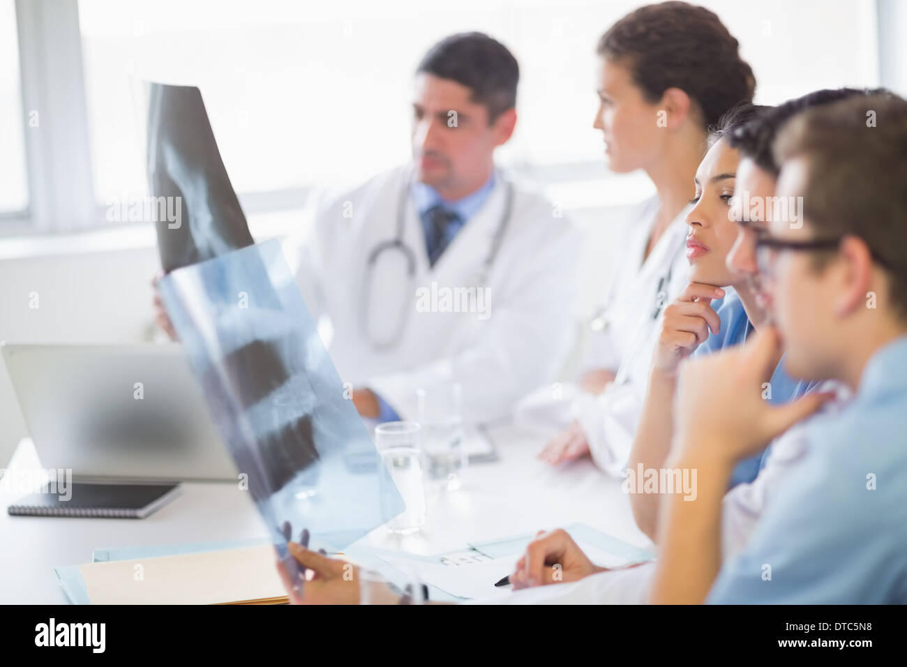 Medical team analyzing Xrays Stock Photo - Alamy