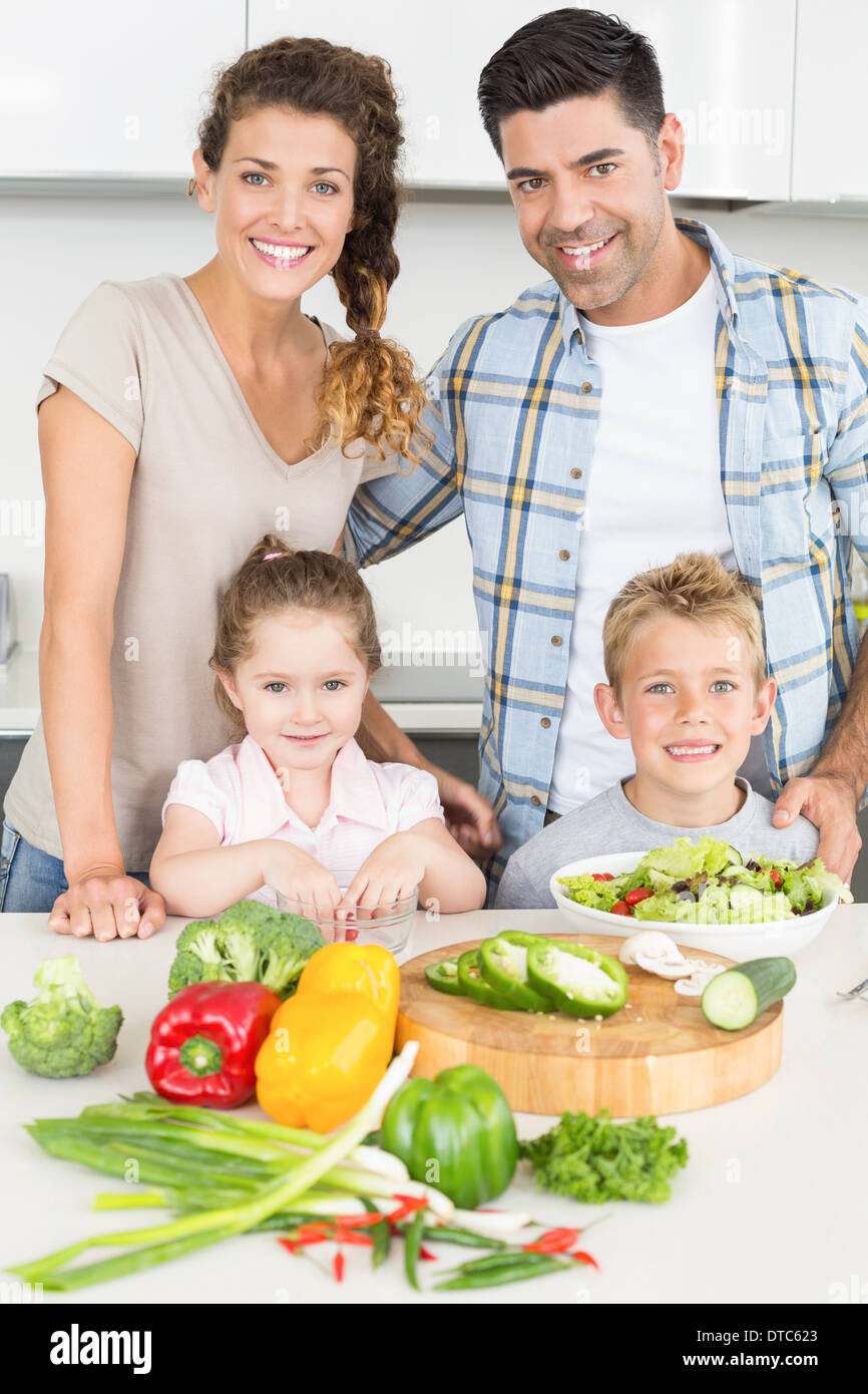 Happy family preparing vegetables together Stock Photo - Alamy