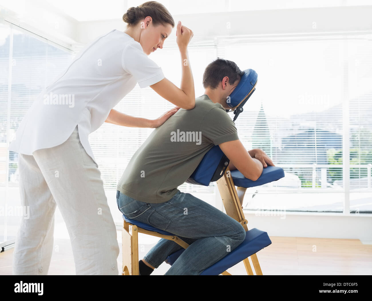 Man receiving massage from physiotherapist Stock Photo - Alamy