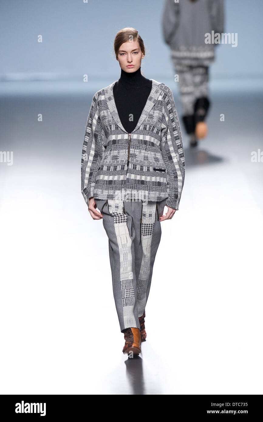 Madrid, Spain. 14th Feb, 2014. A model showcases designs by Etxeberria ...