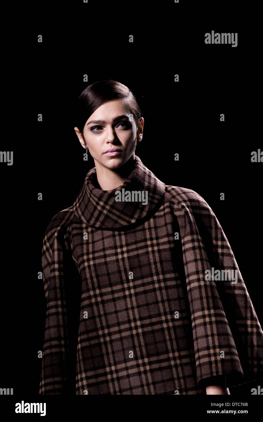 Madrid, Spain. 14th Feb, 2014. A model showcases designs by Devota y ...