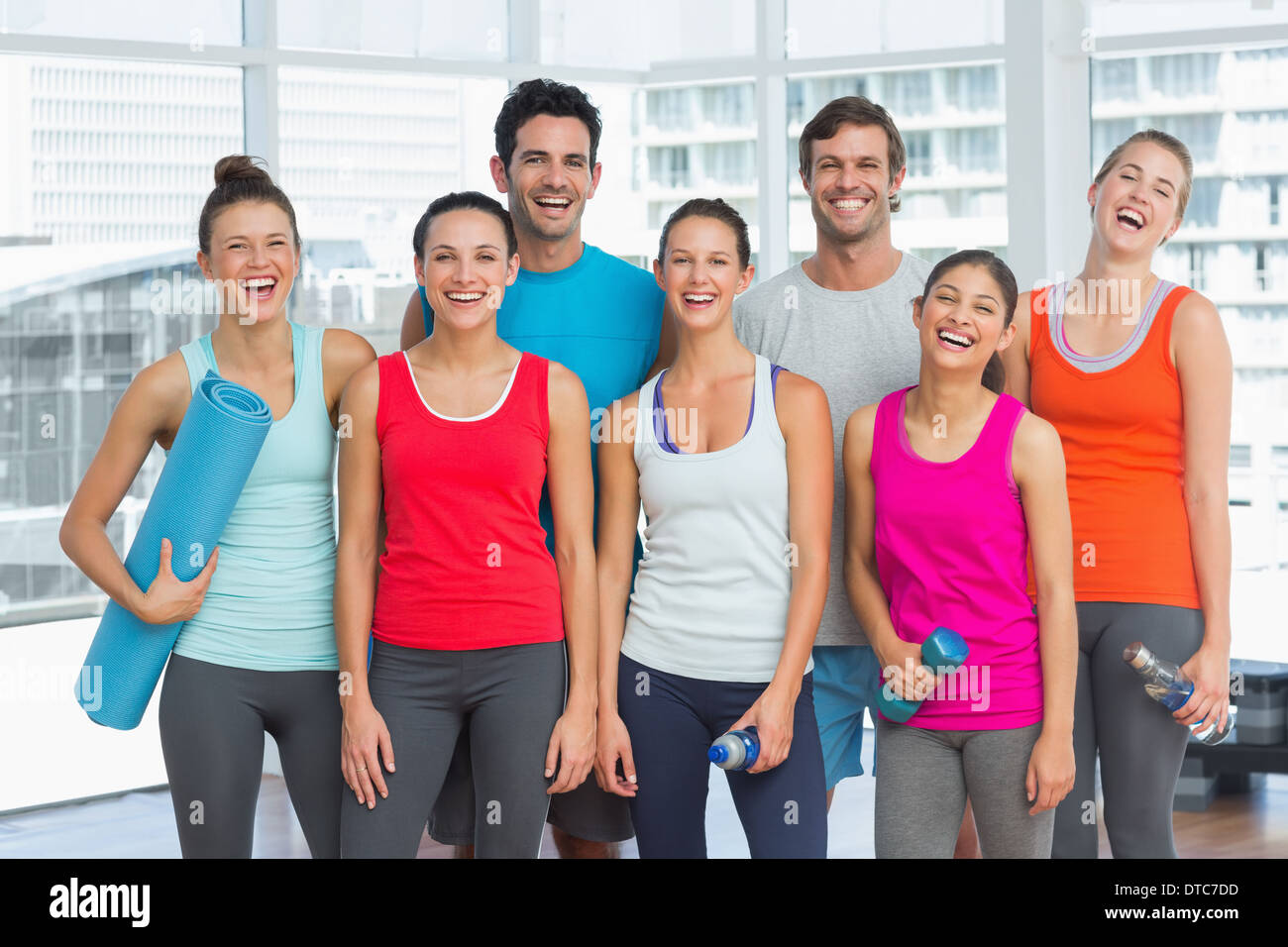 Portrait of fit people smiling in exercise room Stock Photo - Alamy