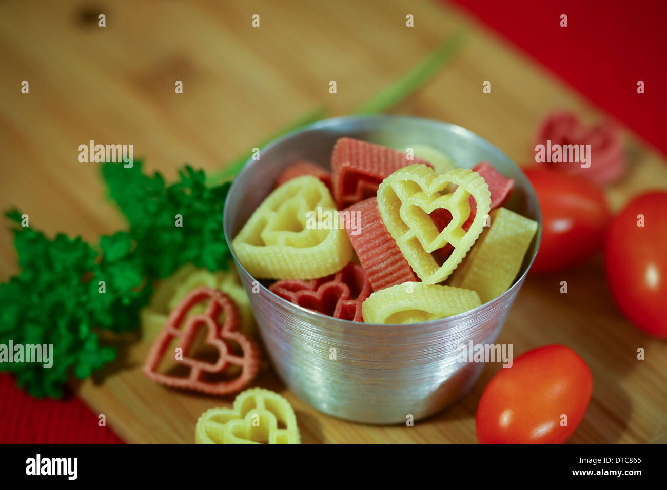 Heart-shaped colored Italian pasta Stock Photo - Alamy