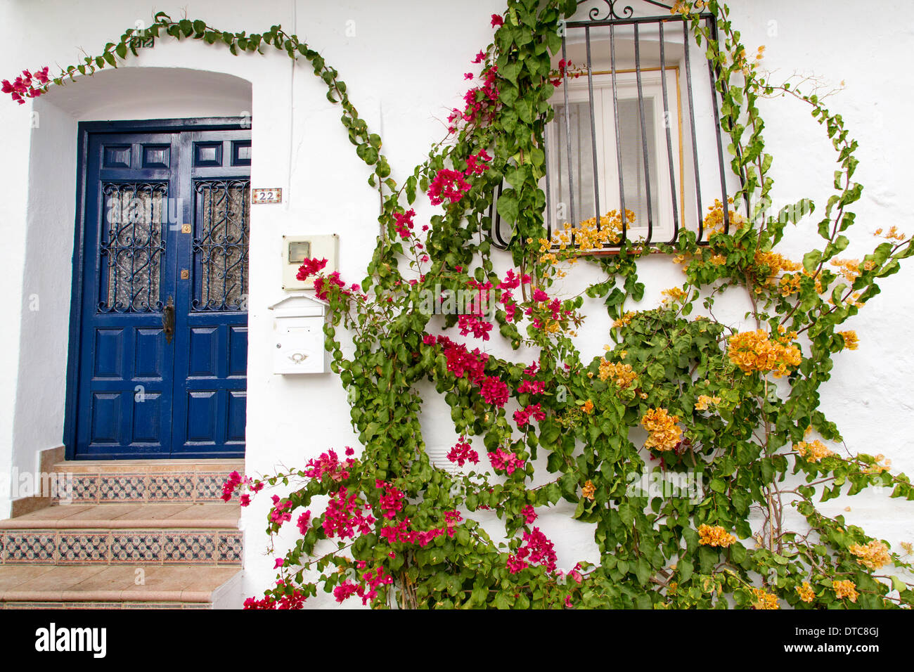 Typical Andalusian house and blue door white village Canillas de ...