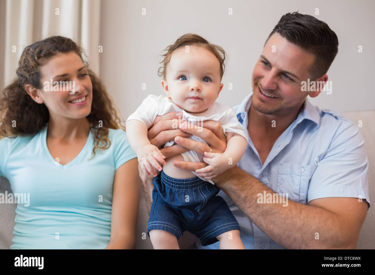 Happy family with baby boy Stock Photo - Alamy