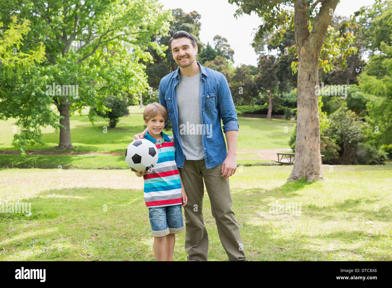 Father and son smiling, soccer ball hi-res stock photography and images ...