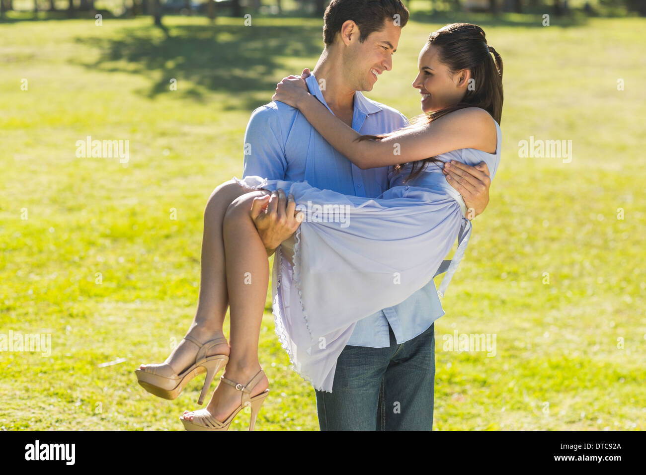 Romantic man carrying woman in hi-res stock photography and images - Alamy