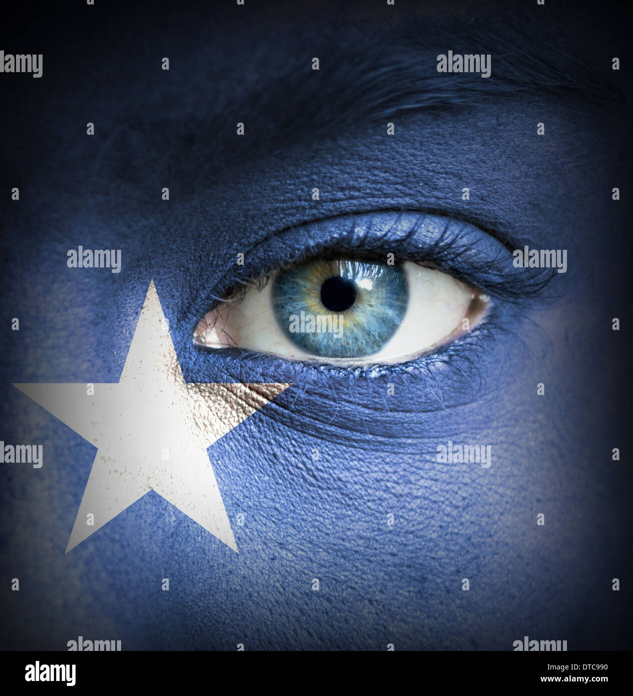 Human face painted with flag of Somalia Stock Photo - Alamy