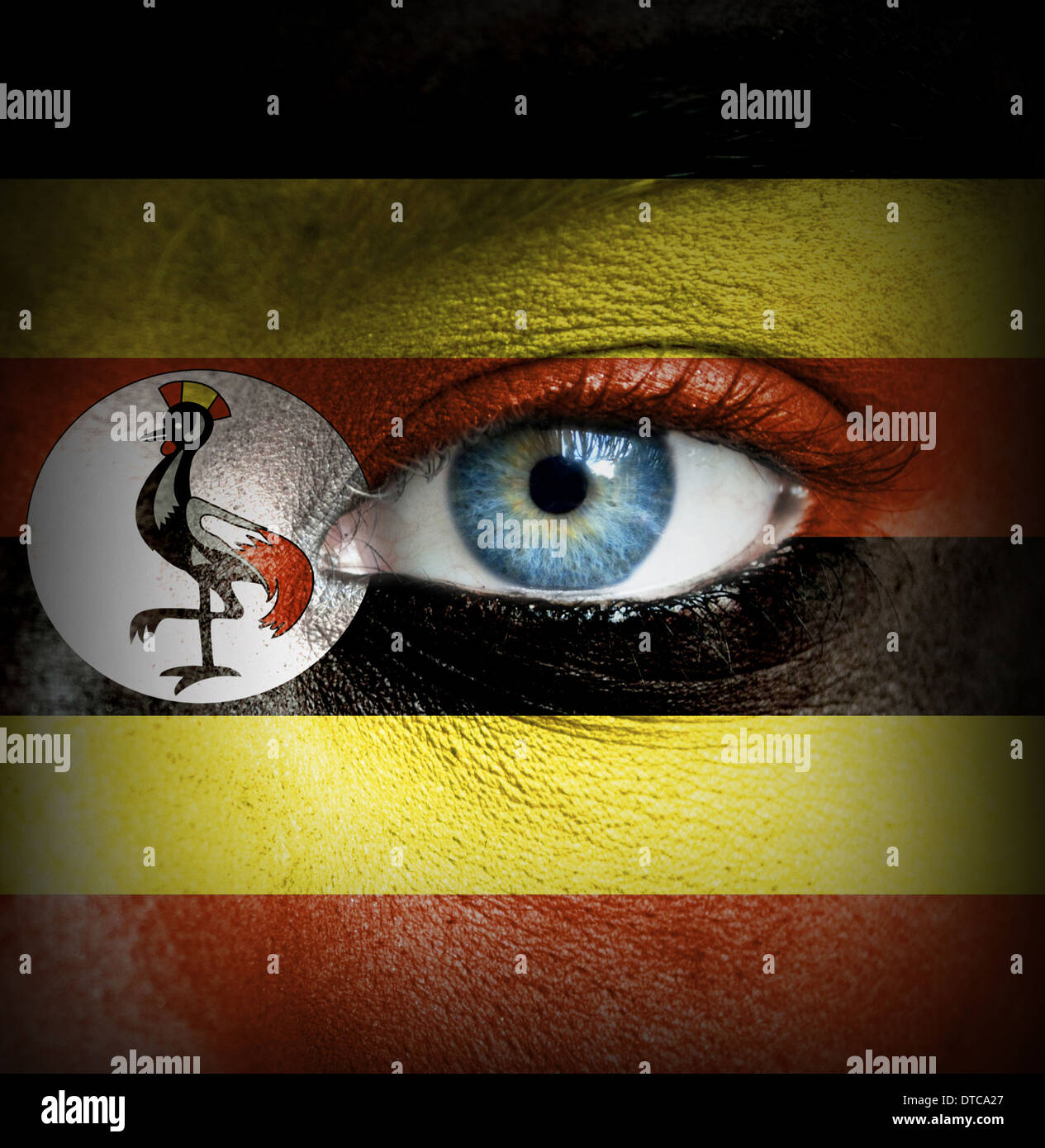 Human face painted with flag of Uganda Stock Photo - Alamy