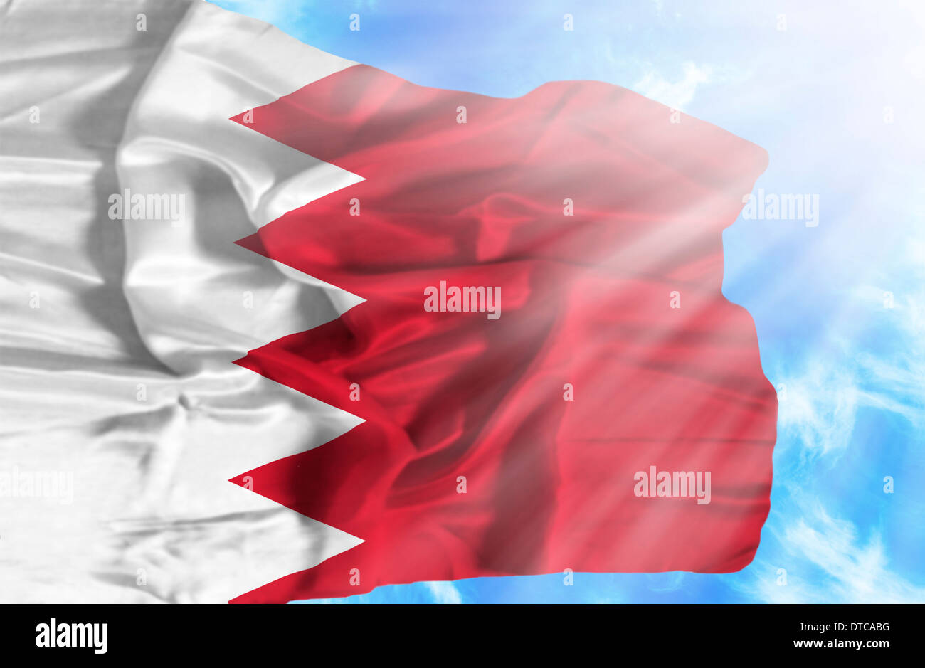 Bahrain waving flag against blue sky with sunrays Stock Photo - Alamy