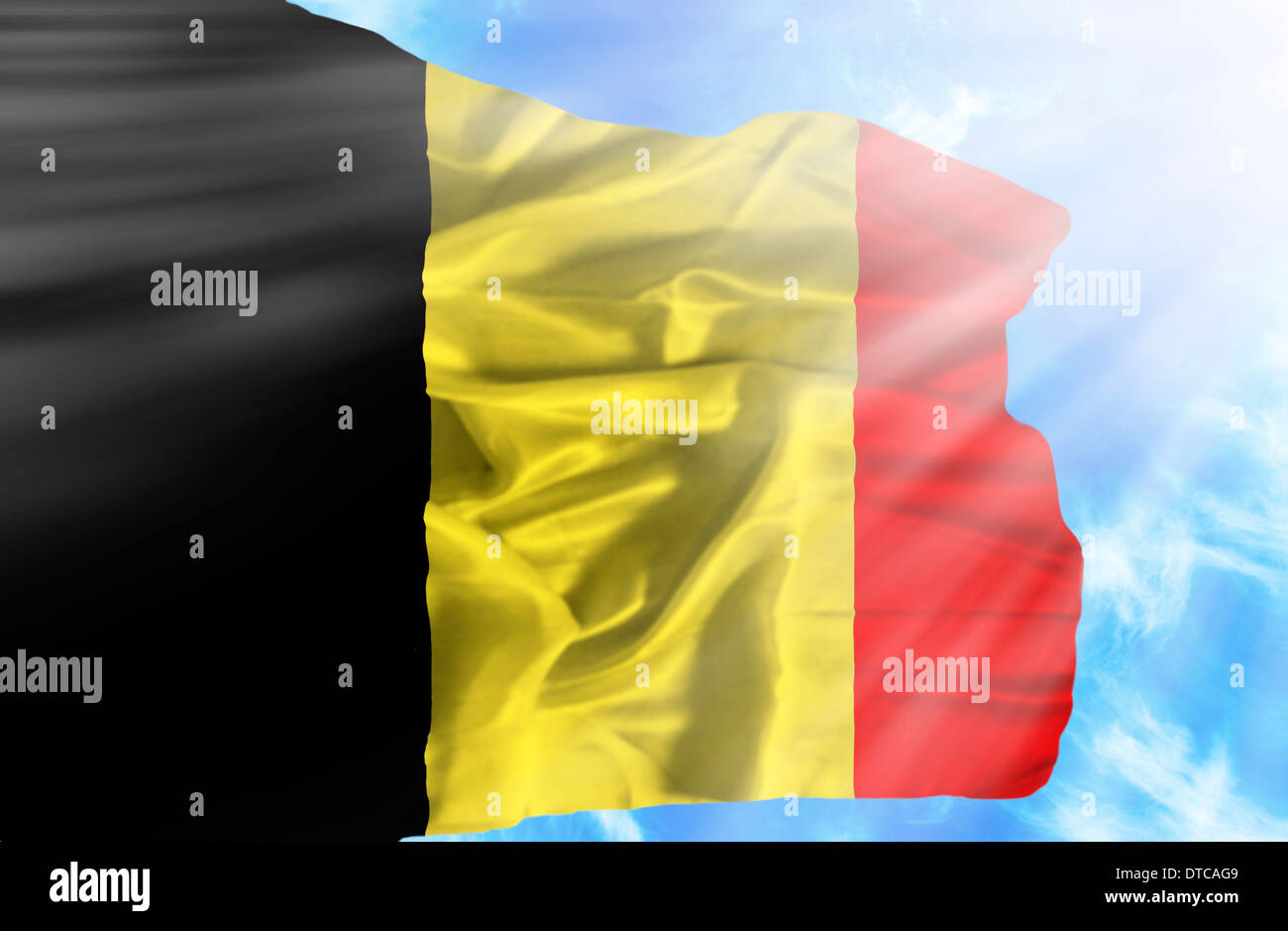 Belgium waving flag against blue sky with sunrays Stock Photo - Alamy
