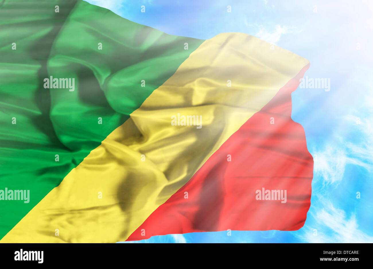 Congo Republic waving flag against blue sky with sunrays Stock Photo ...