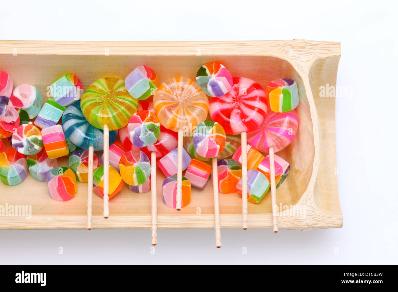 colorful candies on bamboo plate Stock Photo - Alamy