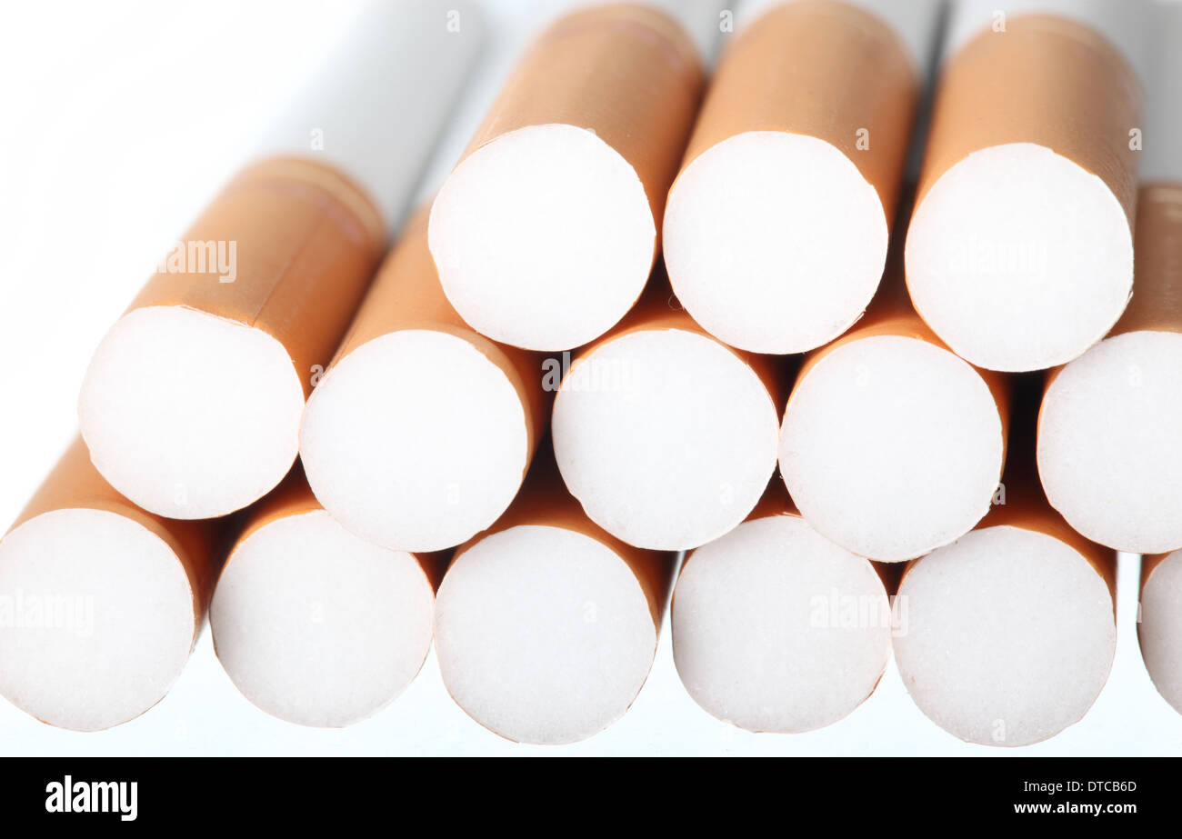 Closeup view of a pile of cigarettes Stock Photo - Alamy